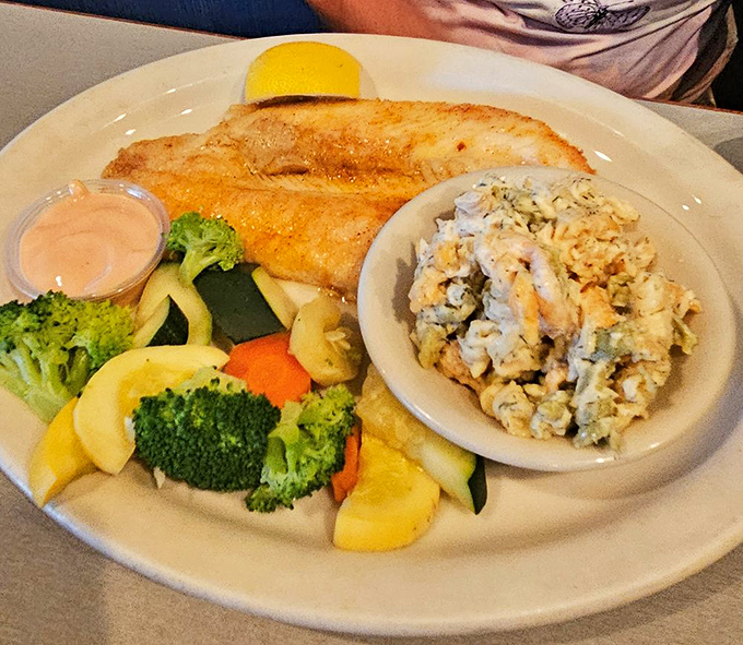 Fish so perfectly cooked it practically winks at you. That golden crust is hiding the tender, flaky treasure within.