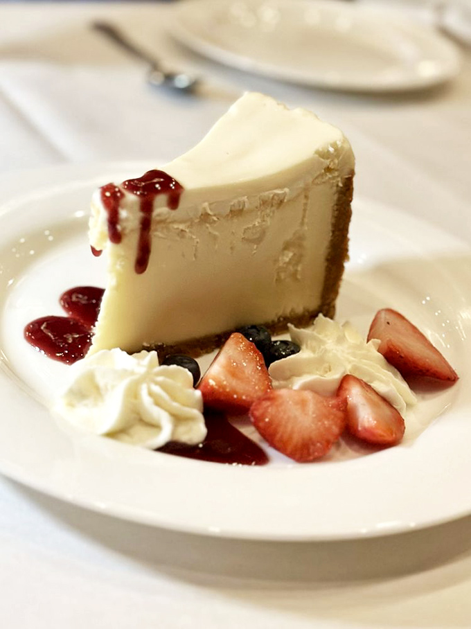 A slice of cheesecake that makes you understand why people write songs about dessert. Those berries aren't garnish&mdash;they're supporting actors.