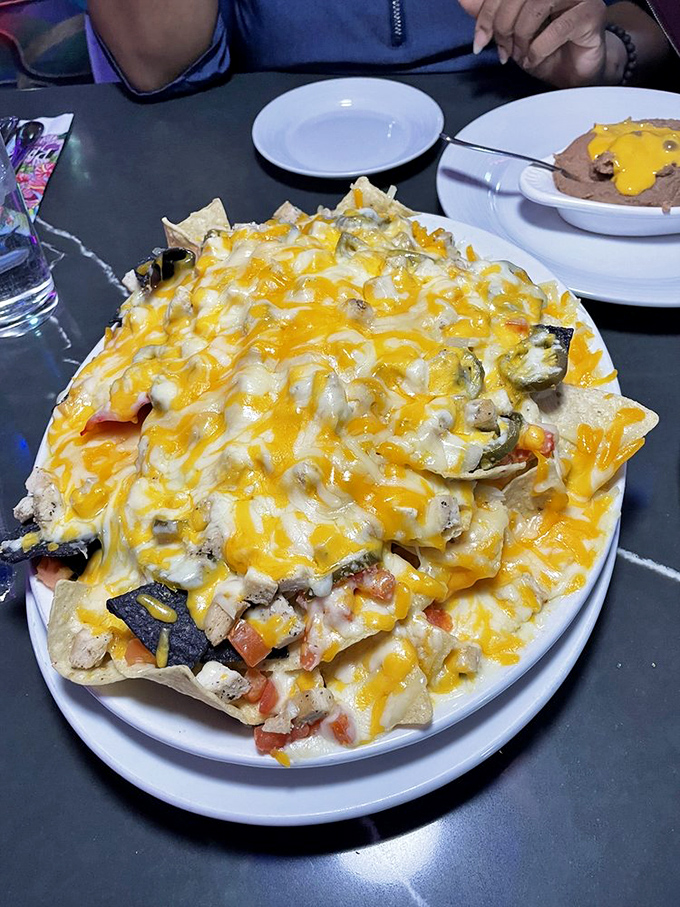 Nachos that require a structural engineer's approval. That melted cheese blanket could solve Vegas's rare cold night problem all on its own.