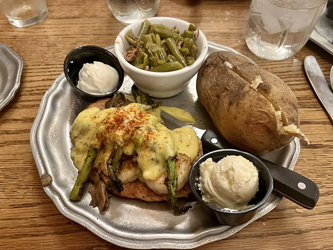 Chicken Oscar elevates poultry to art form status with asparagus and hollandaise&mdash;proof that not all heroes wear capes, some wear sauce.