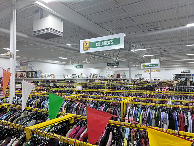 The children's clothing section, where colorful pennants fly above an ocean of tiny outfits that kids will outgrow faster than you can say "growth spurt."