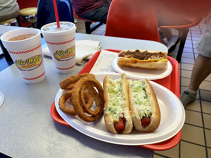 The onion rings form golden halos around these slaw dogs, creating a meal that's both heavenly and deliciously down-to-earth.