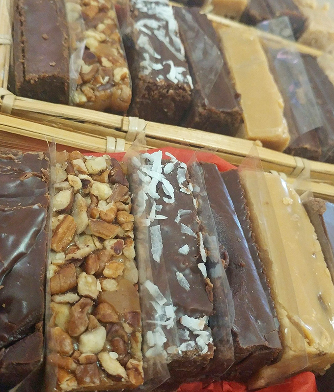 Fudge slabs stacked like edible architecture, some crowned with nuts, others with coconut&mdash;each one a testament to butter and sugar's magical friendship.