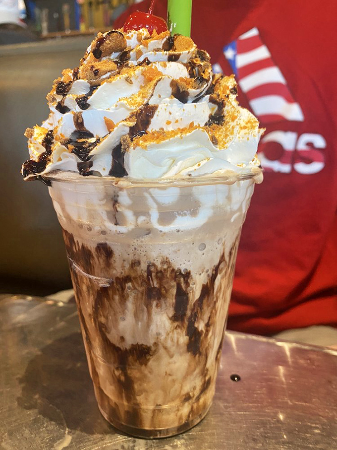 Not so much a milkshake as a skyscraper of indulgence. This isn't dessert—it's therapy in a glass with a Butterfinger bonus.