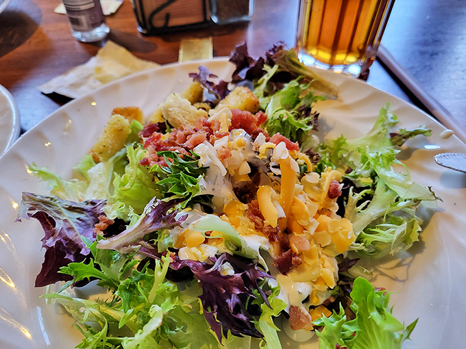 A salad that deserves its own ZIP code! Crisp greens playing host to a party of flavors that proves eating healthy doesn't mean sacrificing joy.