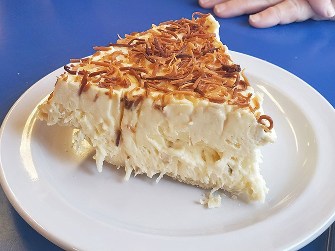 Coconut cream pie topped with toasted coconut shards—a tropical vacation that costs less than airfare and doesn't require sunscreen.