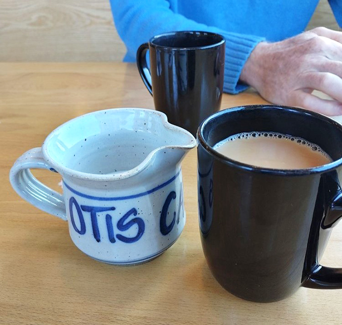 That custom ceramic creamer alongside robust coffee in sturdy mugs &ndash; small details that reveal how much this place cares.
