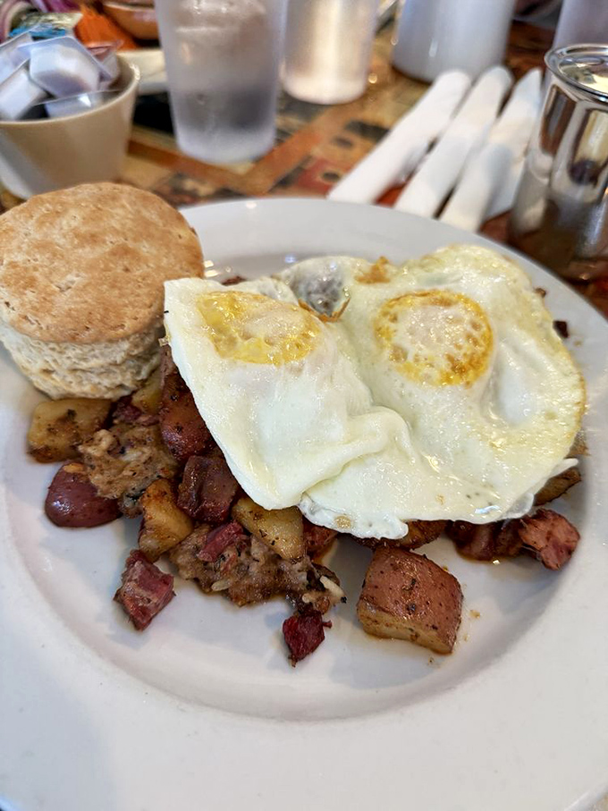 Rustic corned beef hash topped with sunny-side-up eggs &ndash; the kind of breakfast that makes you want to high-five the chef.