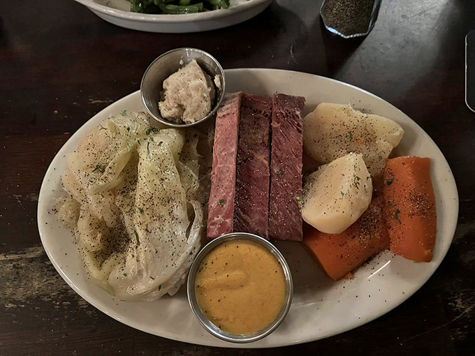 Corned beef sliced with surgical precision alongside cabbage and potatoes &ndash; the holy trinity of Irish comfort that feels like a grandmother's hug.