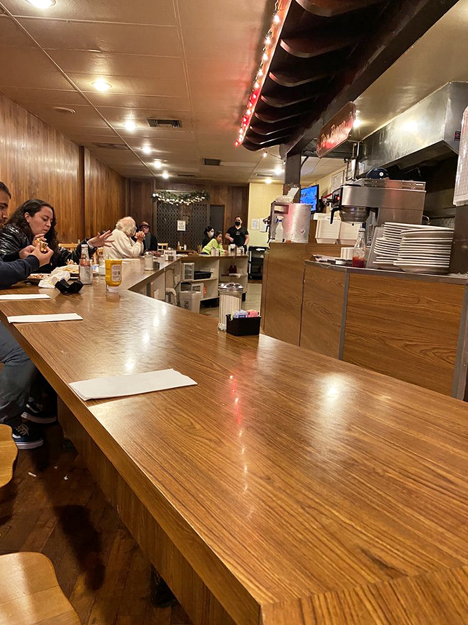 That polished wooden counter has heard more Pasadena secrets and supported more elbows than any therapist's couch in town.