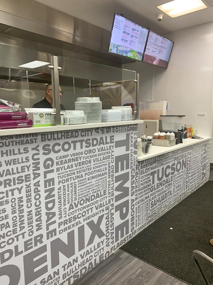 Behind this counter, culinary magic happens daily, with Arizona cities proudly displayed as a reminder of the authentic Southwestern roots.