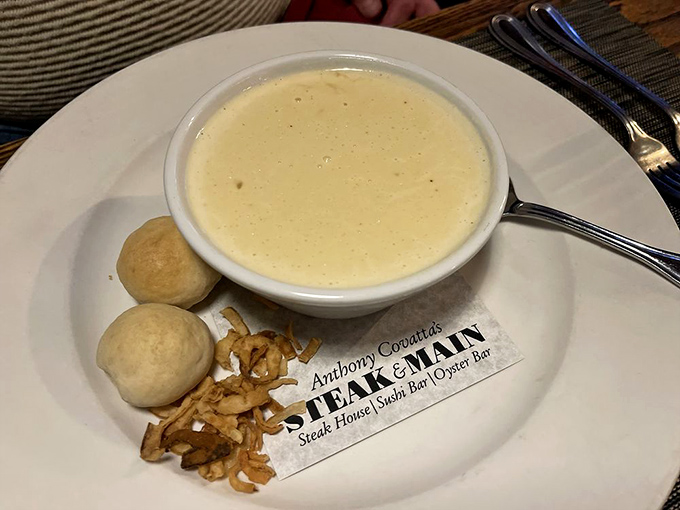Cream of crab soup so rich it probably files its taxes separately from the rest of the meal. Those bread bites are treasure islands in a delicious sea.