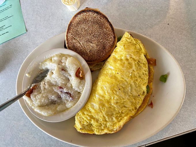 The omelet-grits partnership is the breakfast buddy comedy we didn't know we needed&mdash;creamy, savory, and utterly satisfying.