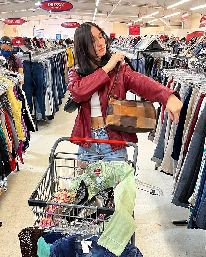 The thrill of the hunt captured in action. That red leather jacket is about to start a new chapter in someone's wardrobe story.