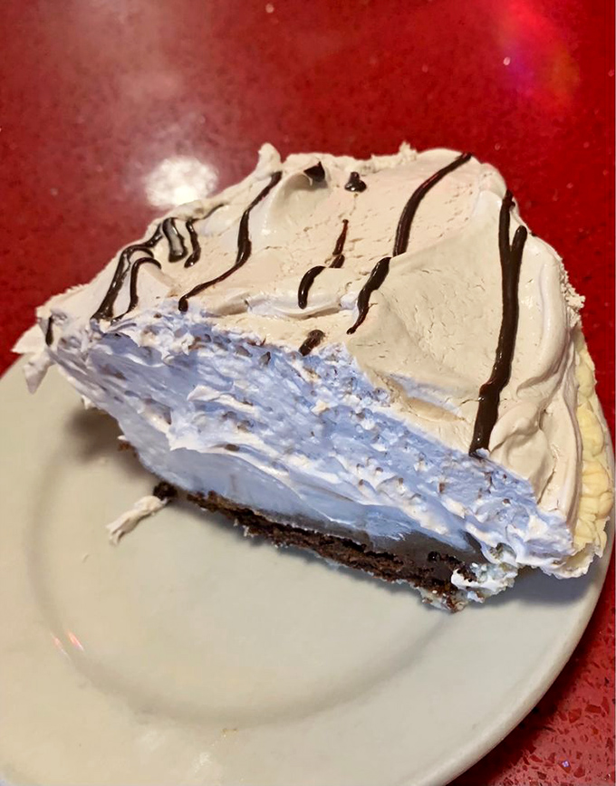 This cream pie doesn't just satisfy a sweet tooth&mdash;it recalibrates it. The chocolate drizzle is just showing off at this point.