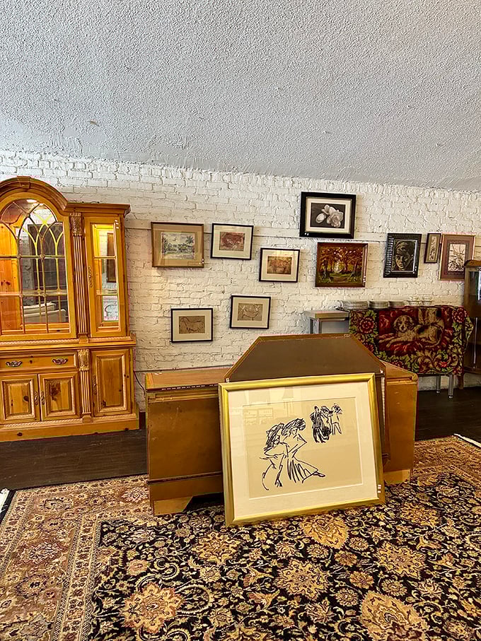 A gallery wall emerges organically among the furniture, proving good taste doesn't require a designer's budget&mdash;just a good eye.