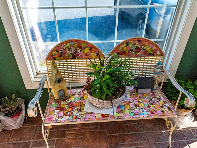 That mosaic bench by the entrance offers a moment of whimsy before the serious business of eating begins.