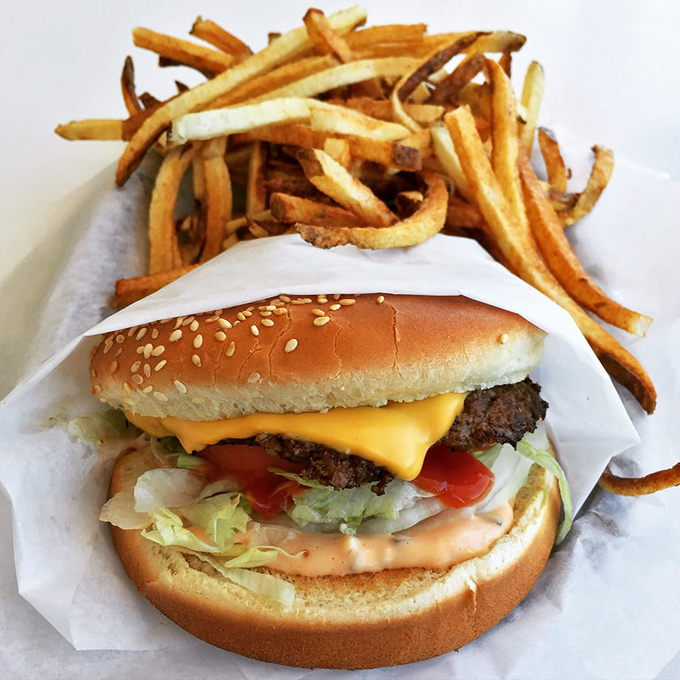 The classic American burger and fries &ndash; where sesame seeds on a bun are the closest thing to "garnish" you'll find here.