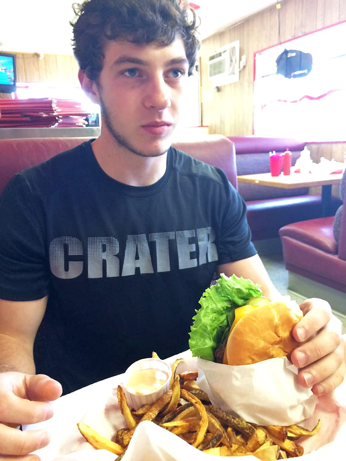 Red and white striped counter, wooden tables, and chalkboard menus &ndash; the timeless diner aesthetic that says "great food happens here."