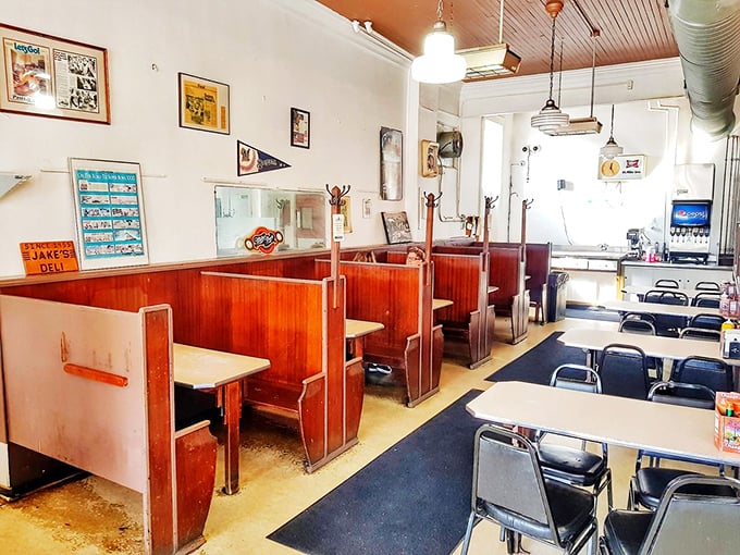 Classic diner seating where strangers become friends over shared appreciation of hand-crafted sandwiches and old-fashioned service.