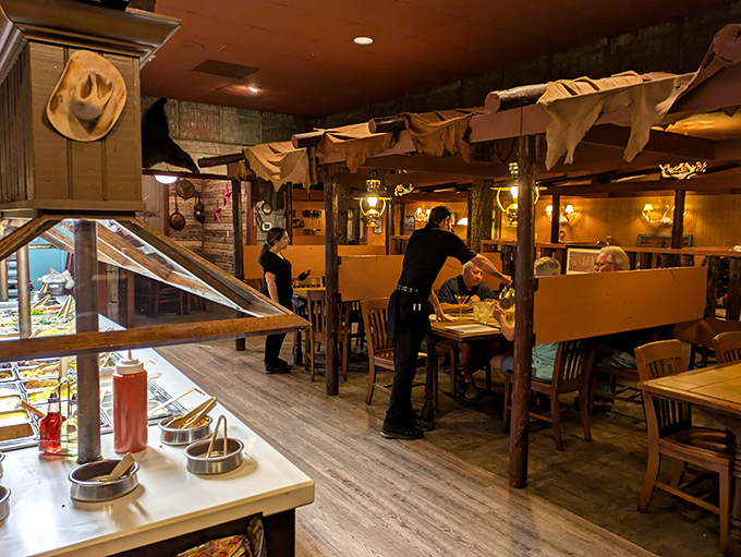 Where wooden beams meet satisfied diners. That server isn't just delivering food; he's delivering moments people will talk about on the ride home.