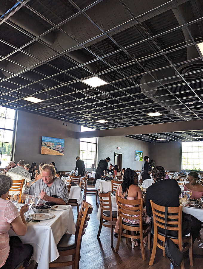 The dining room buzzes with the universal language of satisfied carnivores. Notice nobody's checking their phones—meat demands your full attention.