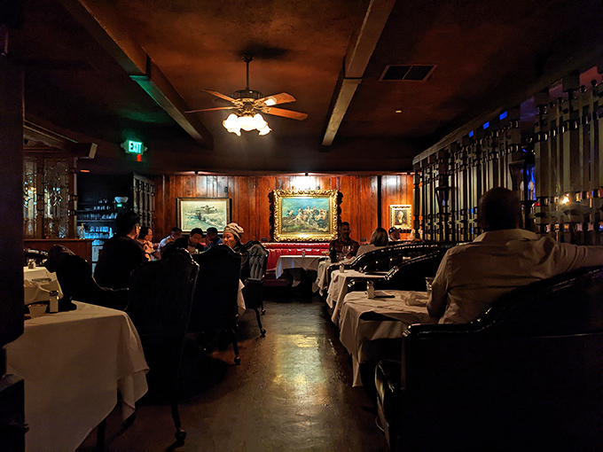 Diners bask in the warm glow of vintage lighting, creating the kind of atmosphere where smartphones stay pocketed and conversations flow freely.