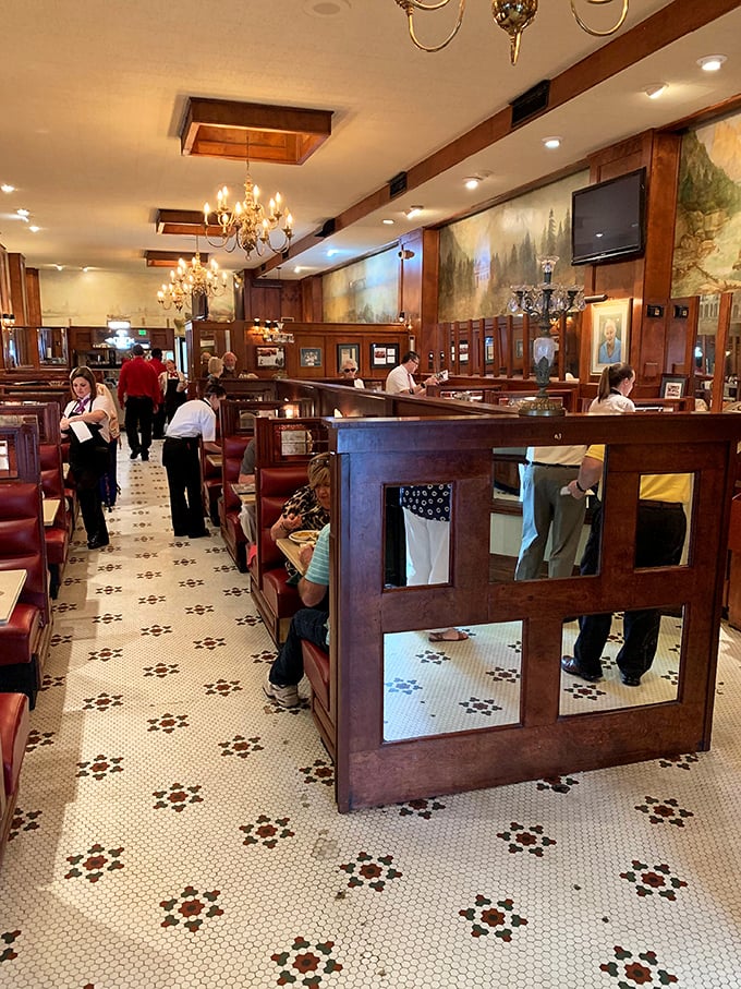 Where servers glide between tables with the precision of Olympic skaters. The Bright Star's dining room choreography is a ballet of Southern hospitality.