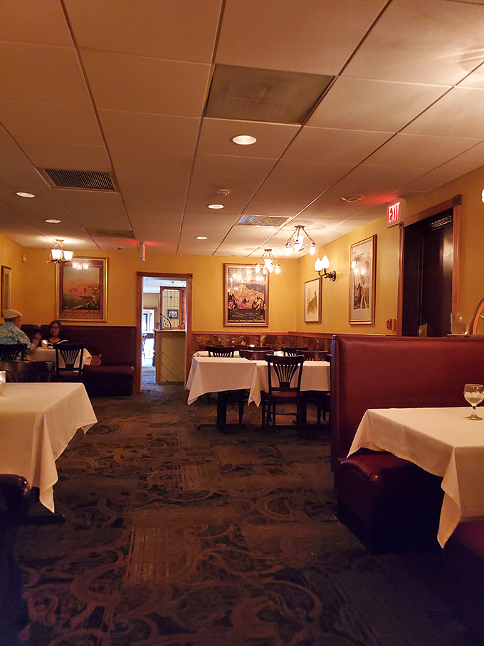 The dining room hums with the energy of satisfied guests. Those high-backed booths create little islands of conversation throughout the evening.