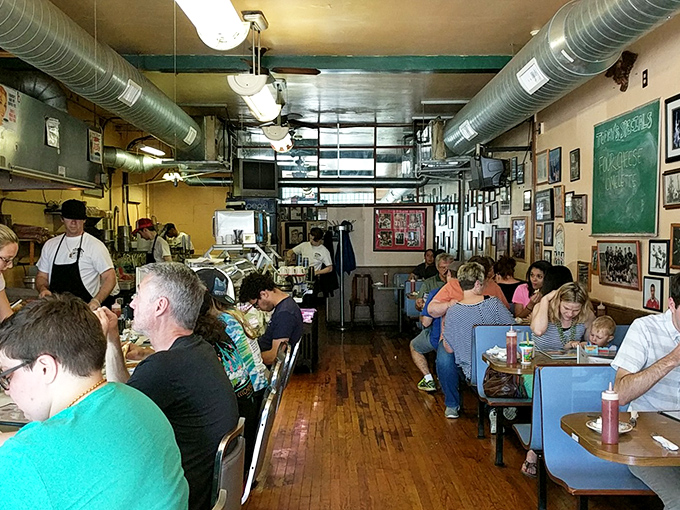 Where strangers become neighbors over coffee refills and the symphony of forks against plates.
