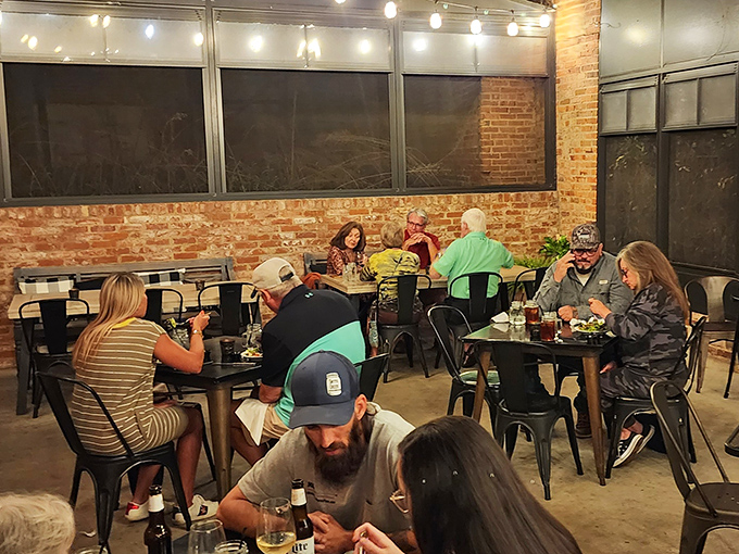 Dining rooms are stages where life happens. This one, with its brick walls and metal chairs, sets the scene for memories worth making.