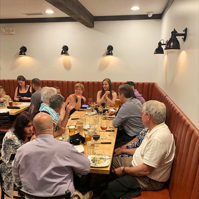 The best conversations happen around tables like this, where food becomes the silent partner in creating memories that outlast the meal.