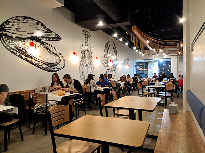 The dining room buzzes with the universal language of seafood enjoyment: the crack of shells and satisfied mmms.