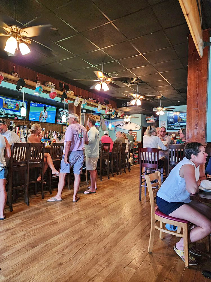The bar fills with a perfect blend of locals and tourists, all united in the universal language of "pass the Old Bay, please."