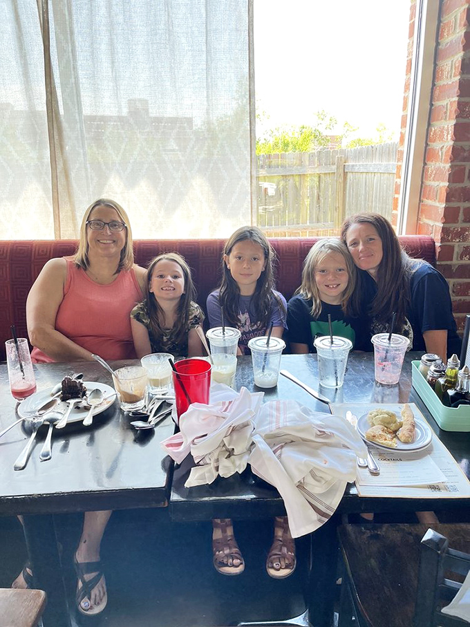 The universal language of pizza brings families together. Four generations sharing one table, creating memories one slice at a time.