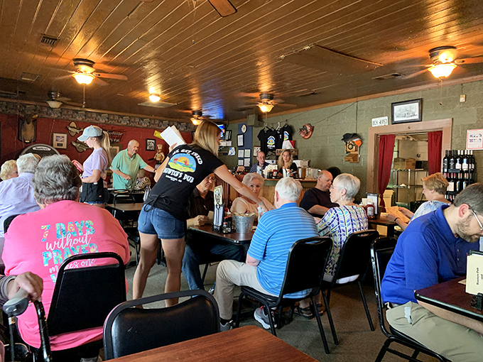The servers here don't just bring food&mdash;they create community. That "Camp Without Pain" shirt says everything about the local philosophy.