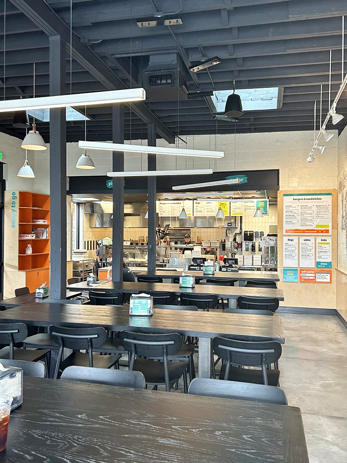 Minimalist industrial design that doesn't distract from the main event. Those pendant lights could illuminate a fashion runway, but they're lighting your lunch instead.