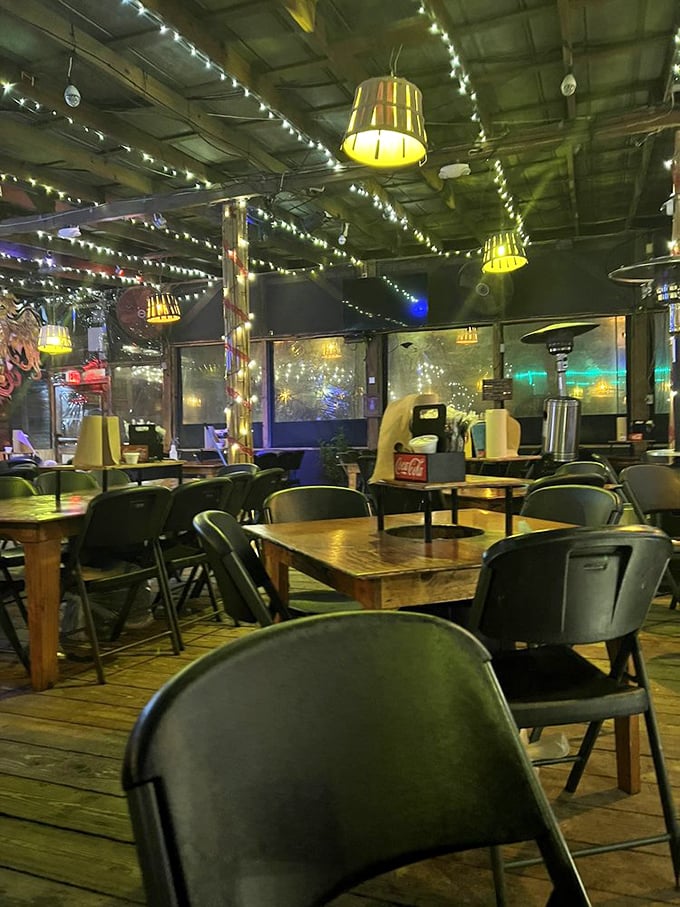 Empty tables waiting for hungry guests&mdash;a rare sight at The Crab Shack. The wooden chairs have heard thousands of "mmms" and "wows."