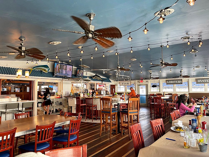 The dining room hums with anticipation and satisfaction. String lights and ceiling fans create the perfect backdrop for seafood memories in the making.