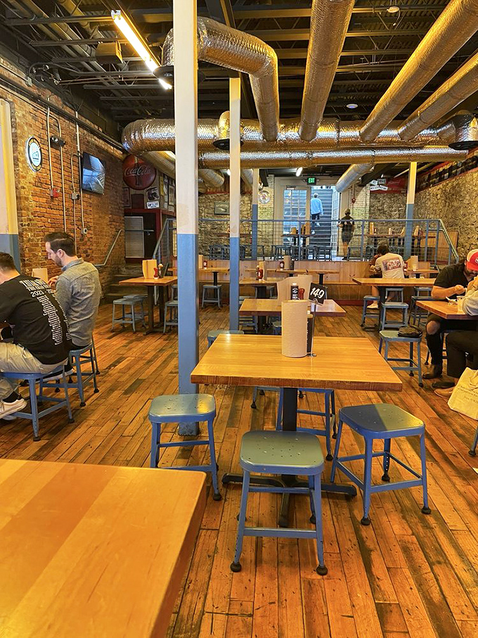 The dining area's wooden charm and industrial touches create the perfect backdrop for the serious business of barbecue appreciation.