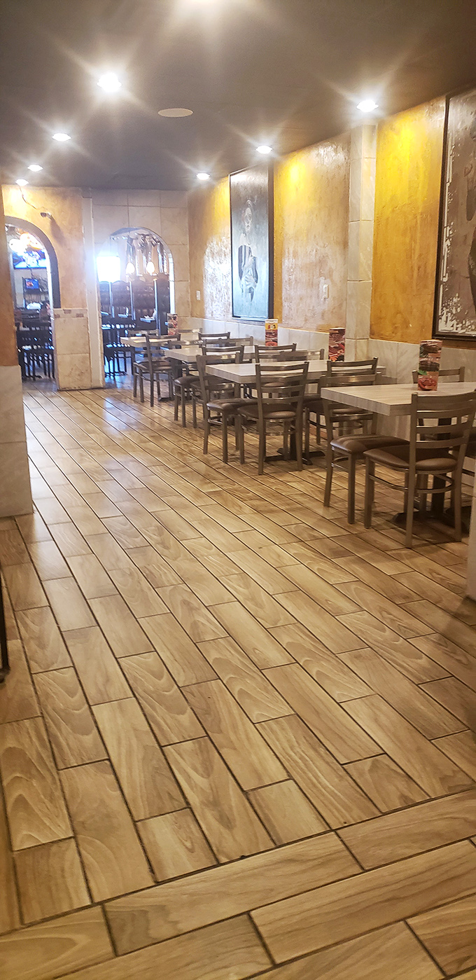 Wood-look tile floors and warm lighting create the perfect backdrop for the food drama about to unfold on your table.