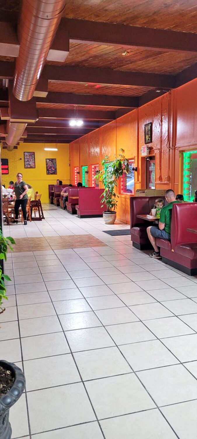 No-nonsense dining area where the focus is squarely on the food. These wooden chairs have heard countless "mmms" of satisfaction.