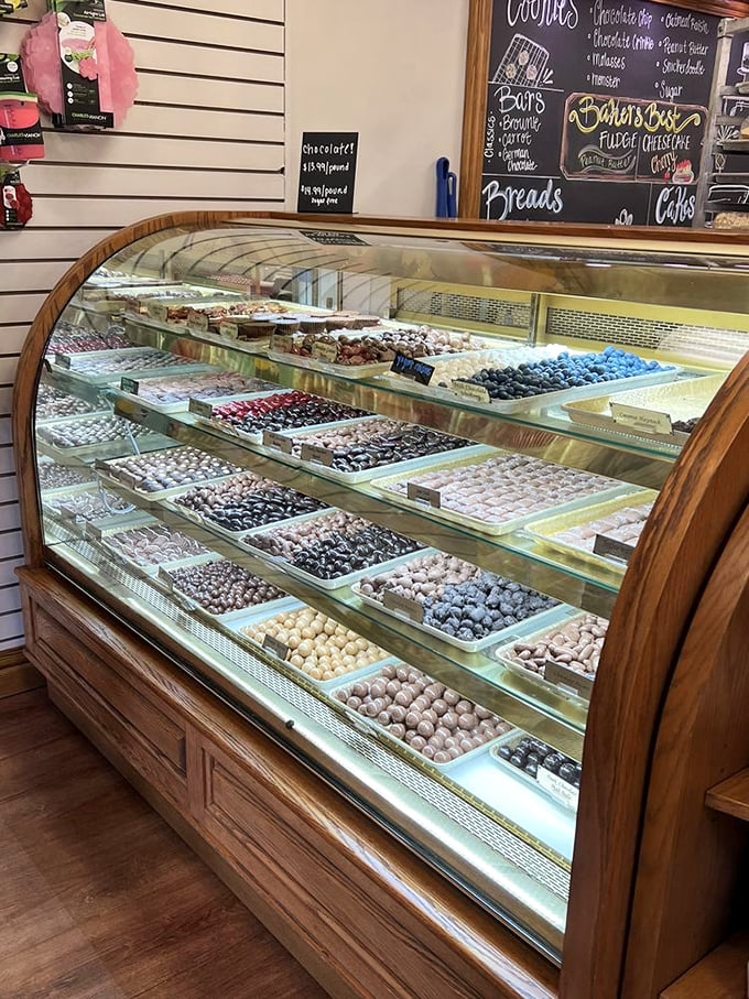 A display case of handcrafted chocolates that would make Willy Wonka jealous &ndash; each one made with patience you can actually taste.