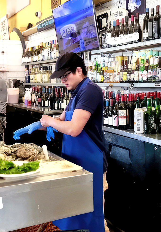Behind every great seafood dish is someone with blue gloves and serious skills. The kitchen crew works with the precision of seafood surgeons.