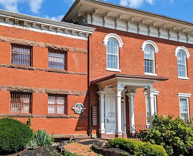 The stately brick facade with its elegant white columns offers no hint of the building's previous tenants who checked in involuntarily.