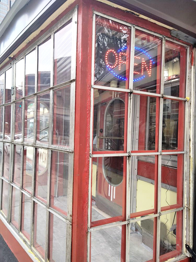 The "OPEN" sign that never goes dark&mdash;Mickey's 24/7 window to the world has welcomed night owls and early birds alike for generations.