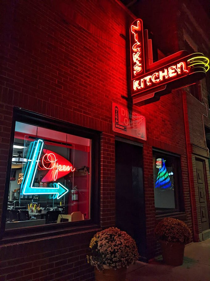 That neon glow isn't just illuminating a storefront – it's a midnight beacon for comfort food pilgrims in downtown Huntington.