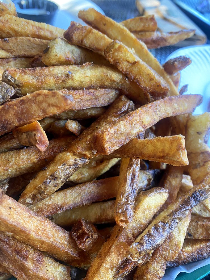 Hand-cut fries with personality—some crispy, some tender, all delicious—the potato's highest calling realized.