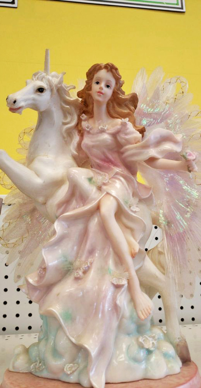 A fairy princess riding a unicorn figurine that somehow manages to be both tacky and magnificent&mdash;the quintessential thrift store find that you didn't know you needed.