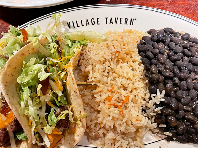 Not your corner taco joint's creation&mdash;Village Tavern elevates the humble taco with tender meat, vibrant rice, and beans that didn't come from a can.